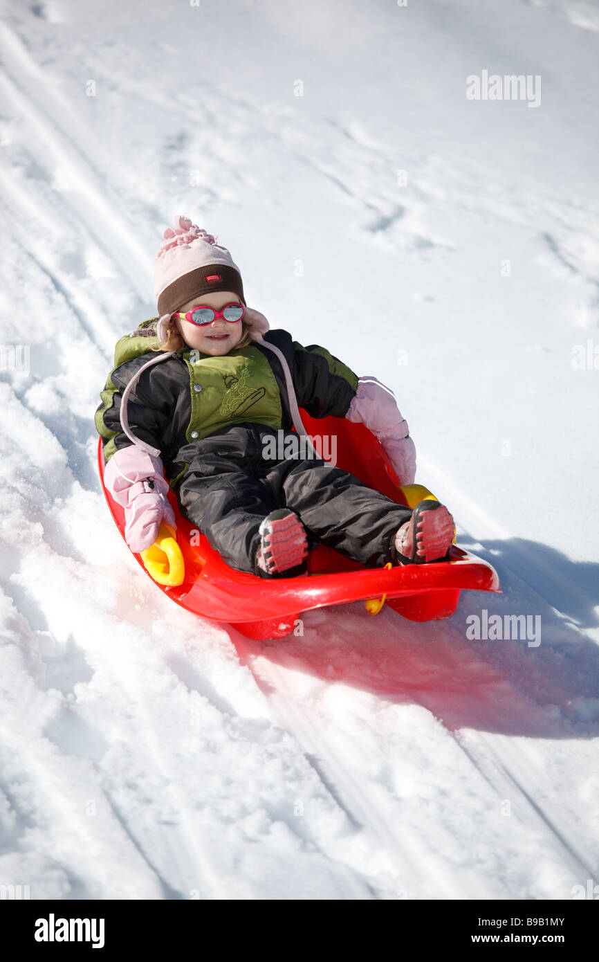 little girl on sled Stock Photo - Alamy
