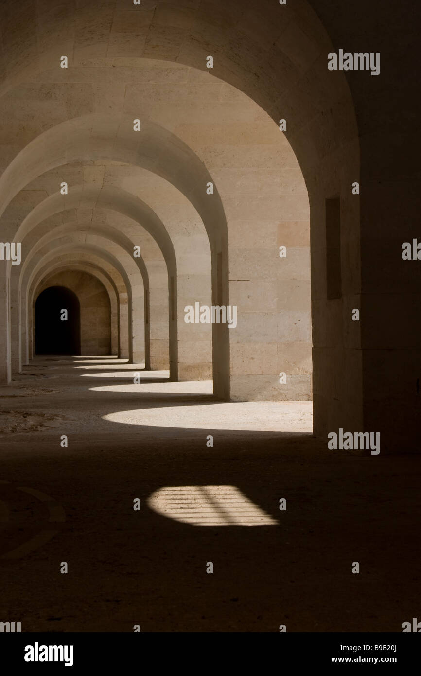Sun shining onto an arched walkway Stock Photo - Alamy