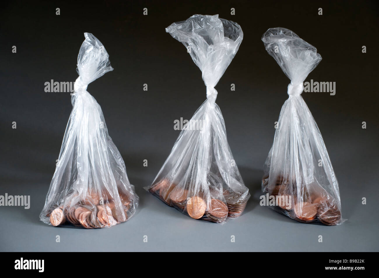 British copper coins counted out and bagged in polythene bags Stock ...