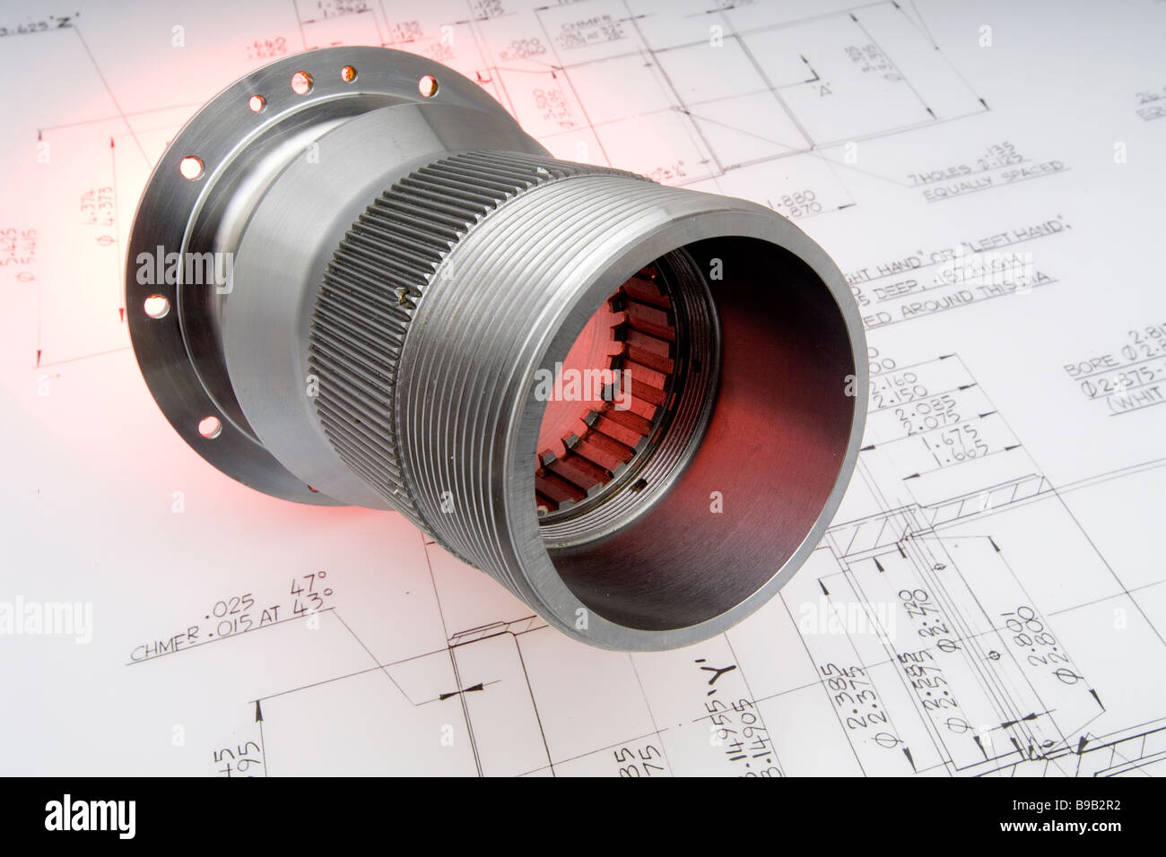 Engineering component photographed on the technical drawing of the ...