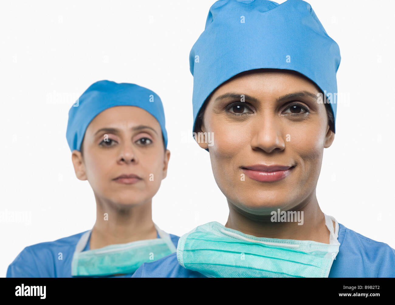 Portrait of two female surgeons smiling Stock Photo - Alamy