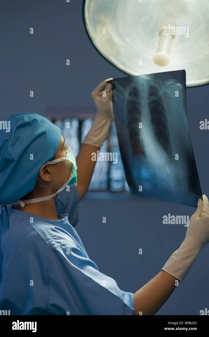 Female surgeon examining an x-ray report Stock Photo - Alamy