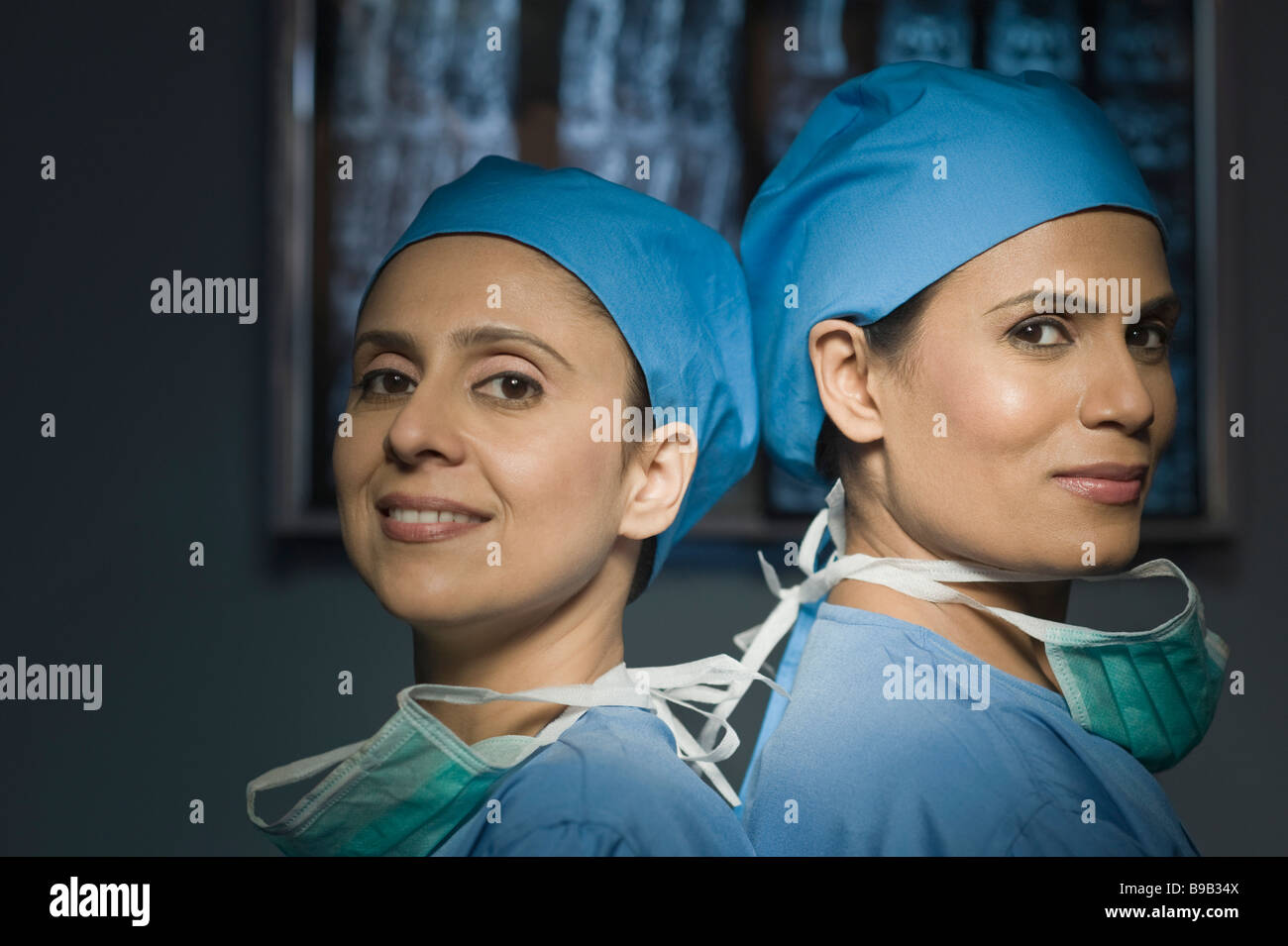 Portrait of two female surgeons smiling Stock Photo - Alamy