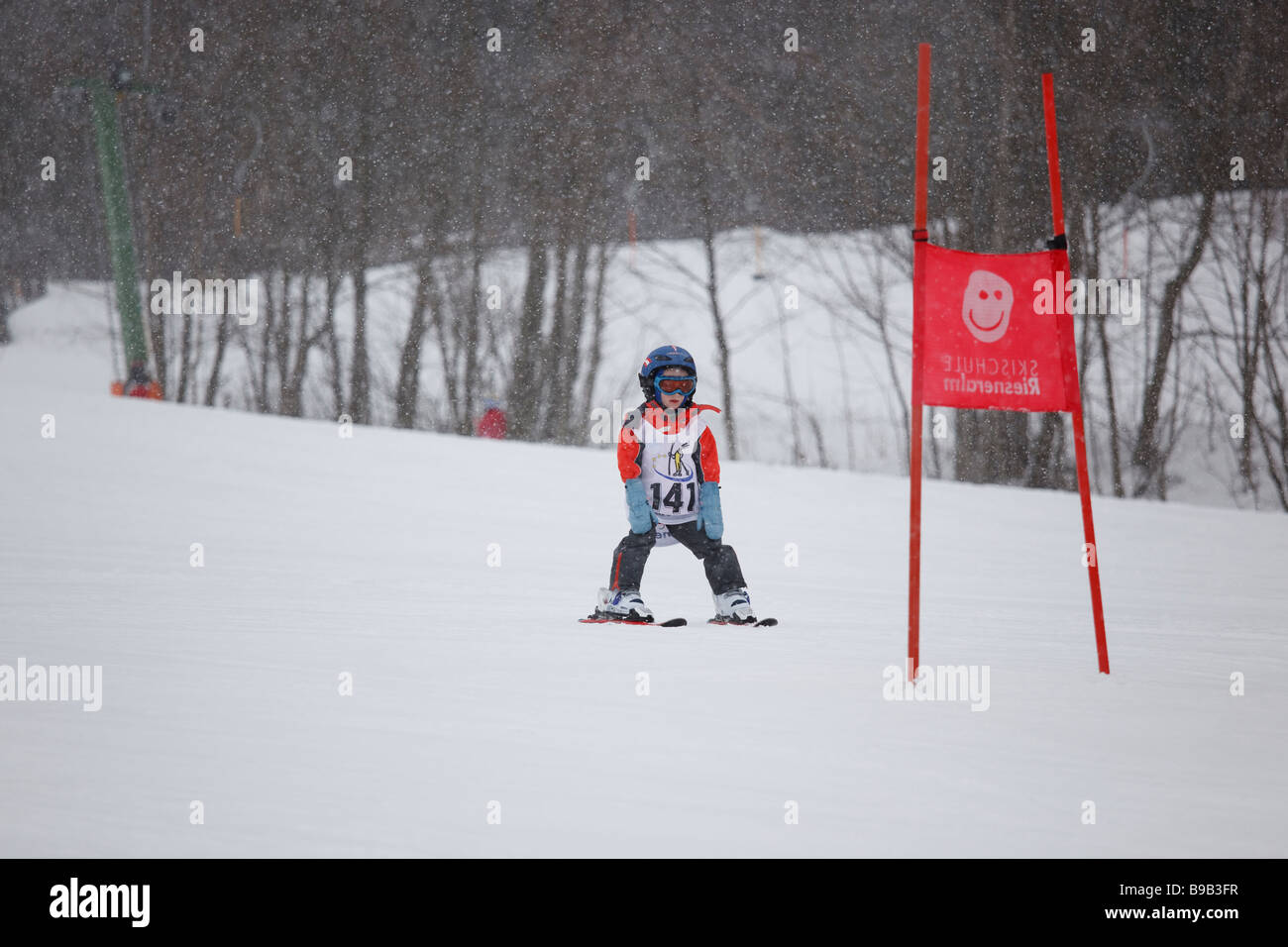little boy at his first skiing race Stock Photo - Alamy