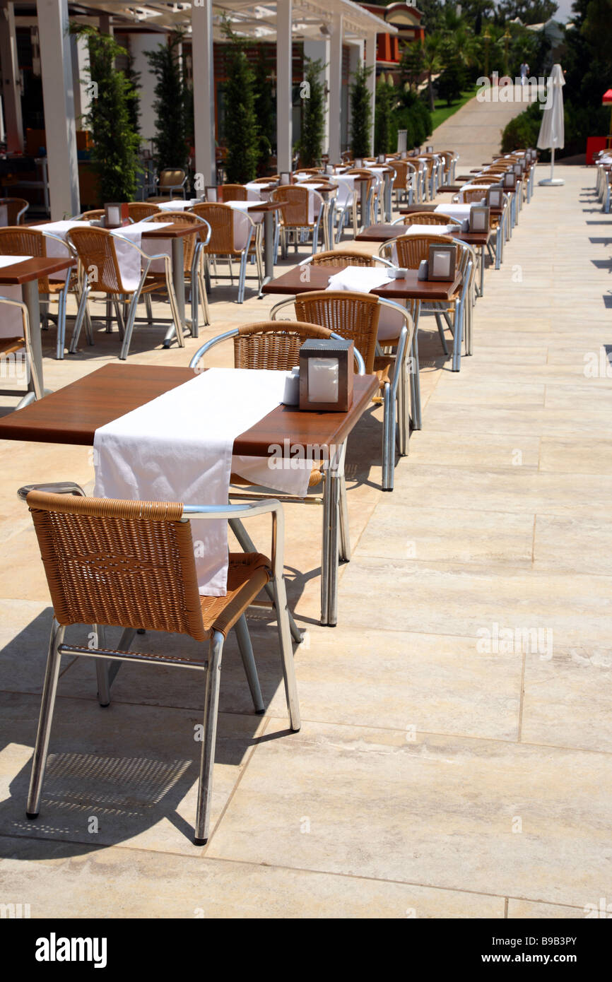 Free tables of restaurant under the hot sun Stock Photo - Alamy