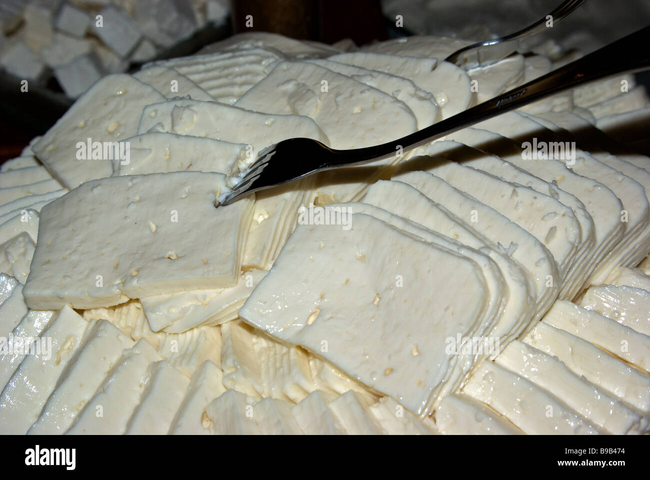 Platter of sliced creamy white pot cheese at breakfast buffet Stock ...