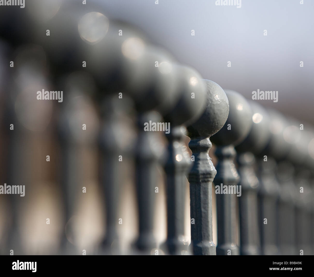 A row of posts from metal railings have been taken using a wide ...