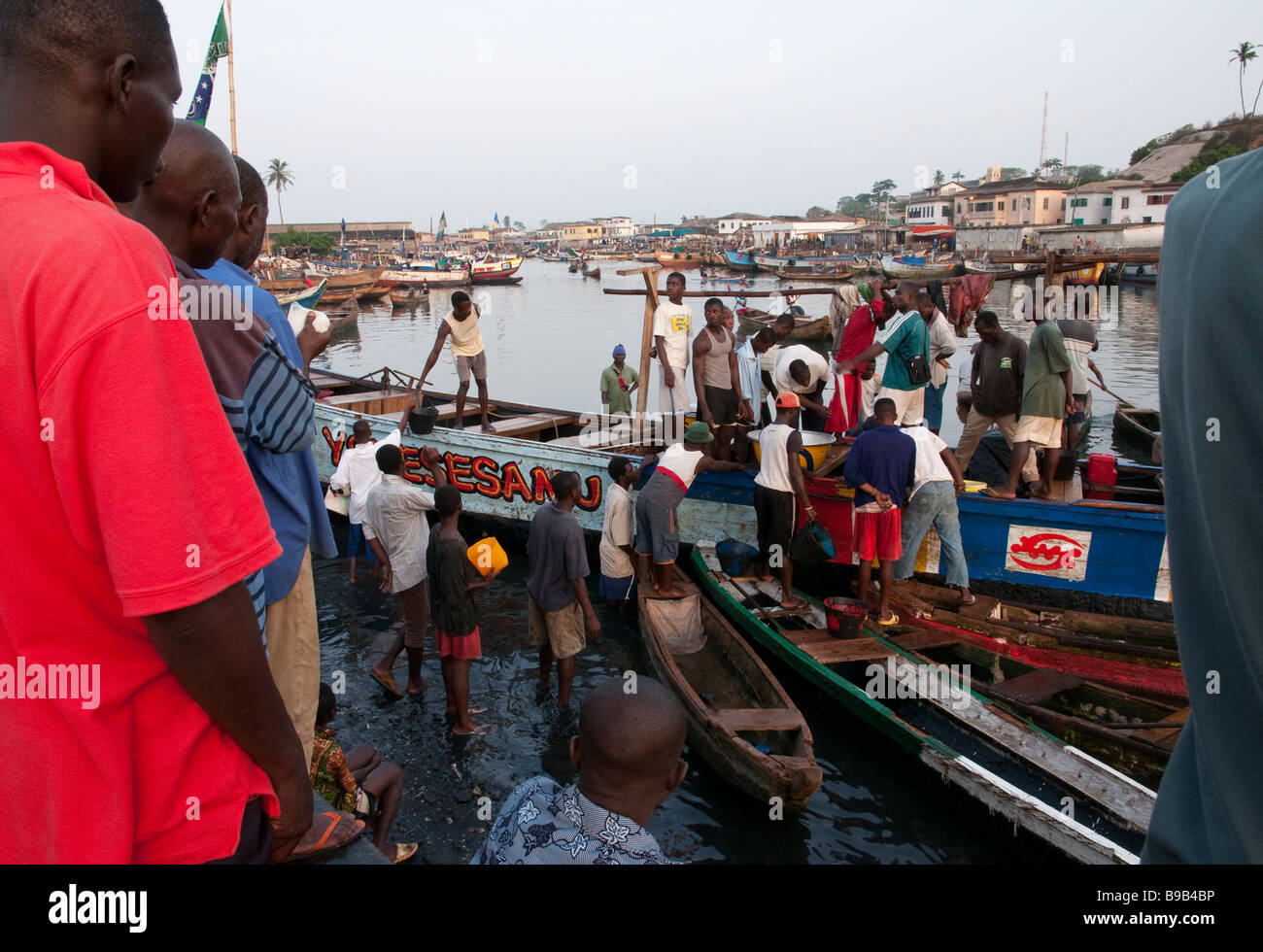 West Africa Ghana Coast Elmina fishing dugouts loaded with fishing nets ...