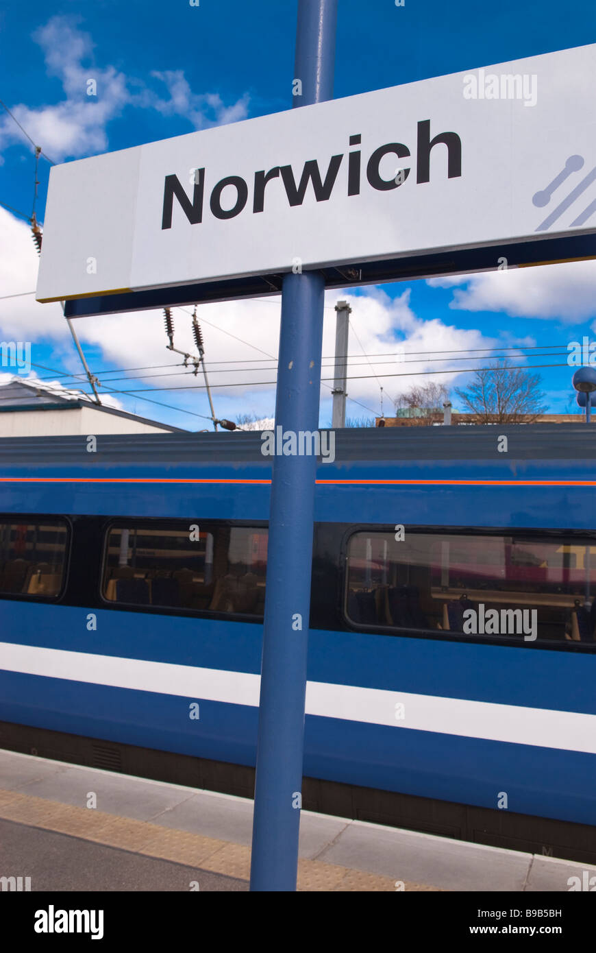 A sign at the station in Norwich,Norfolk,Uk with train in the ...