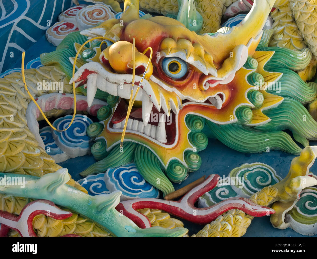 A vividly-coloured Chinese dragon sculpture in a Malaysian Taoist ...