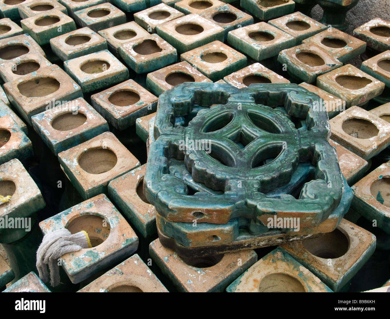 decorative ceramic building components await use in the construction of ...