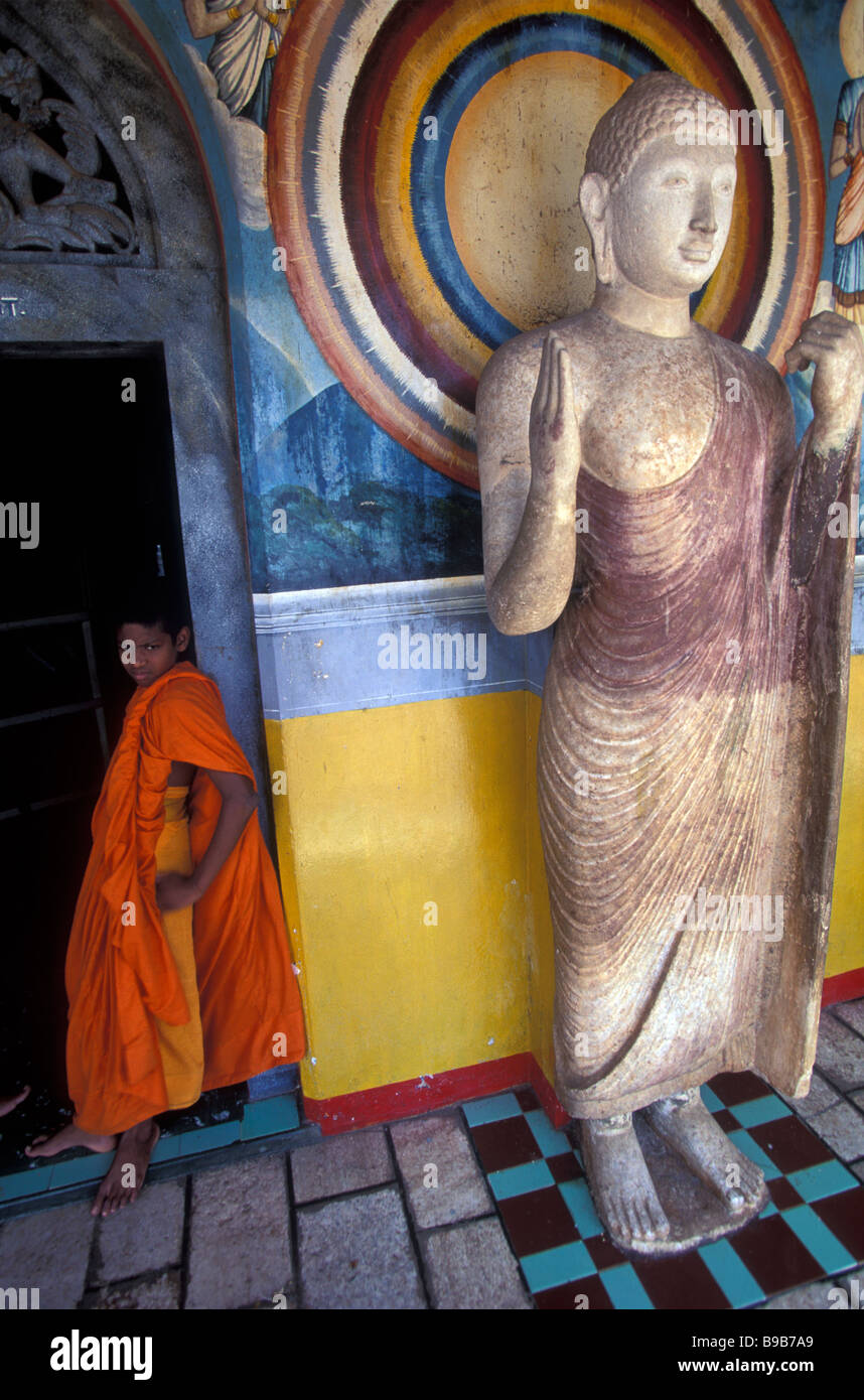 Buddhist monk visits the ancient stupa Stock Photo - Alamy