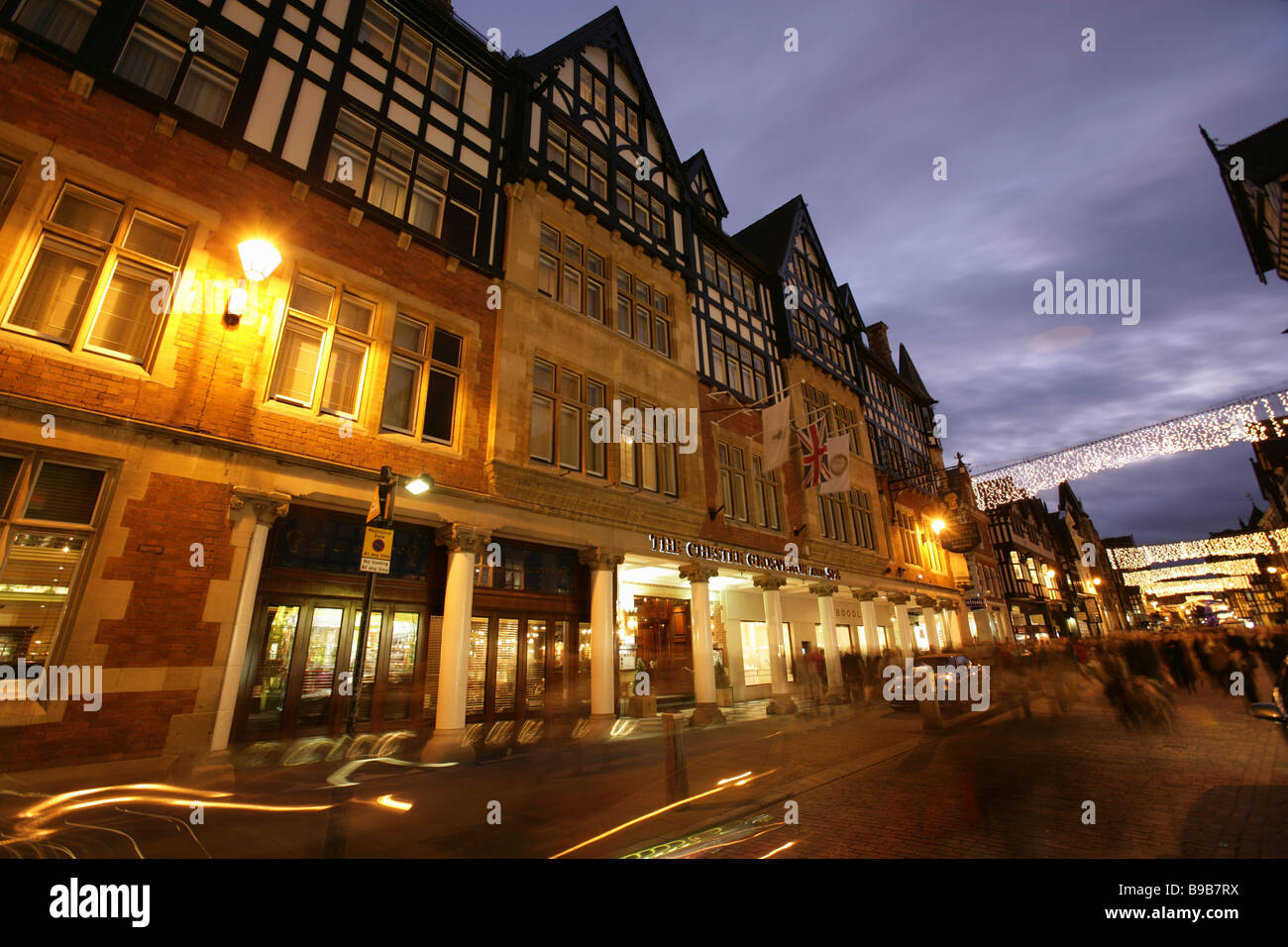 City of Chester, England. Night view of a busy shopping Christmas scene ...