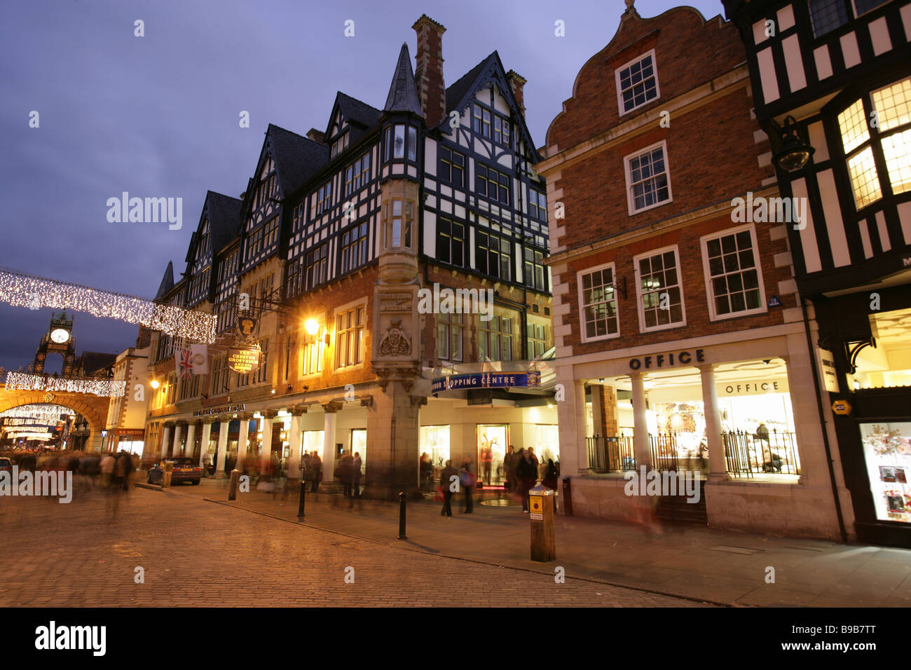 City of Chester, England. Night view of a busy shopping Christmas scene ...