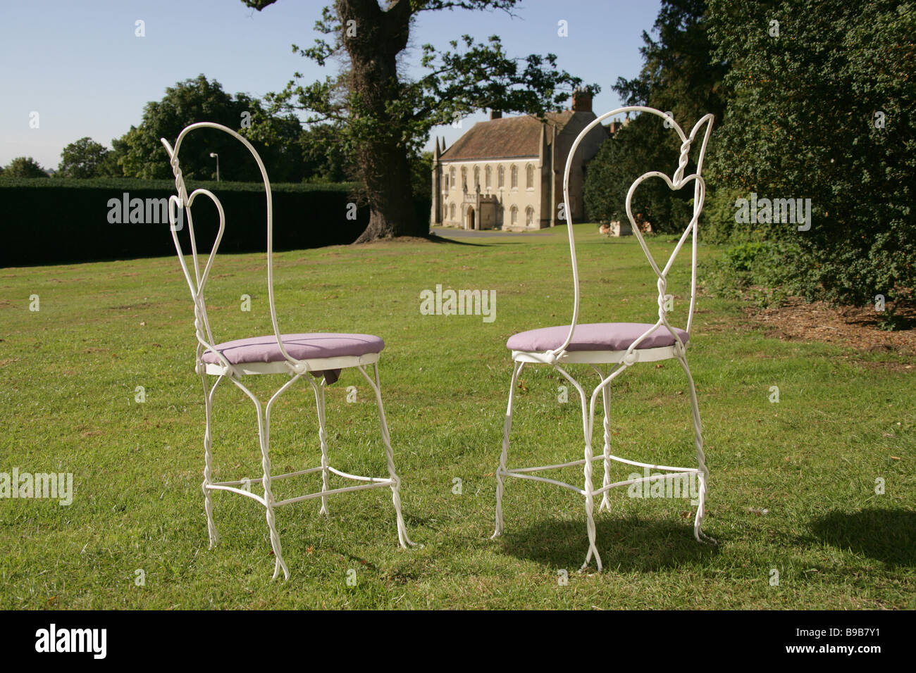Village of Chicksands, England. Two heart shaped love seats at the 12th ...