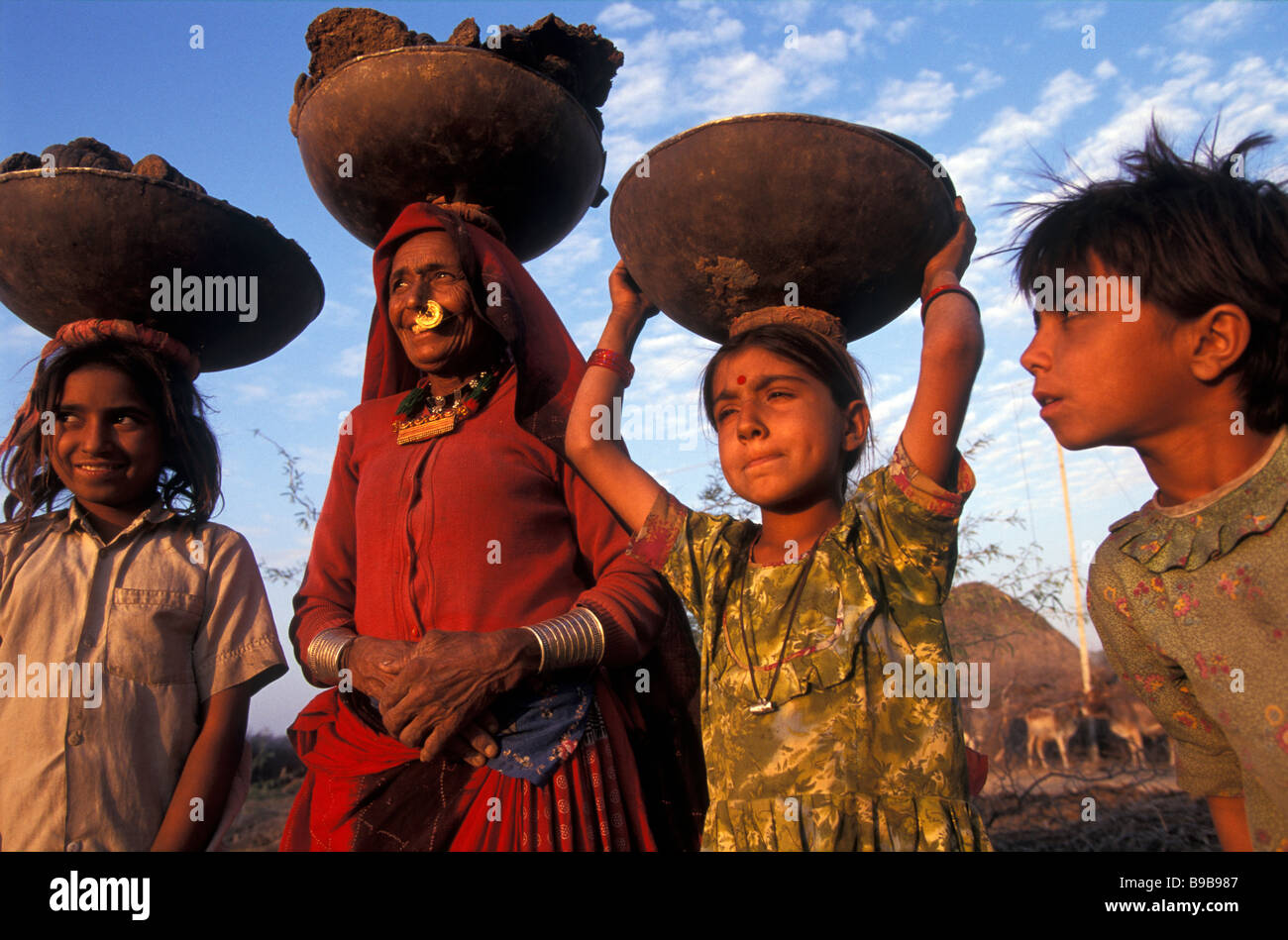 Tribal villagers collect building materials Stock Photo - Alamy