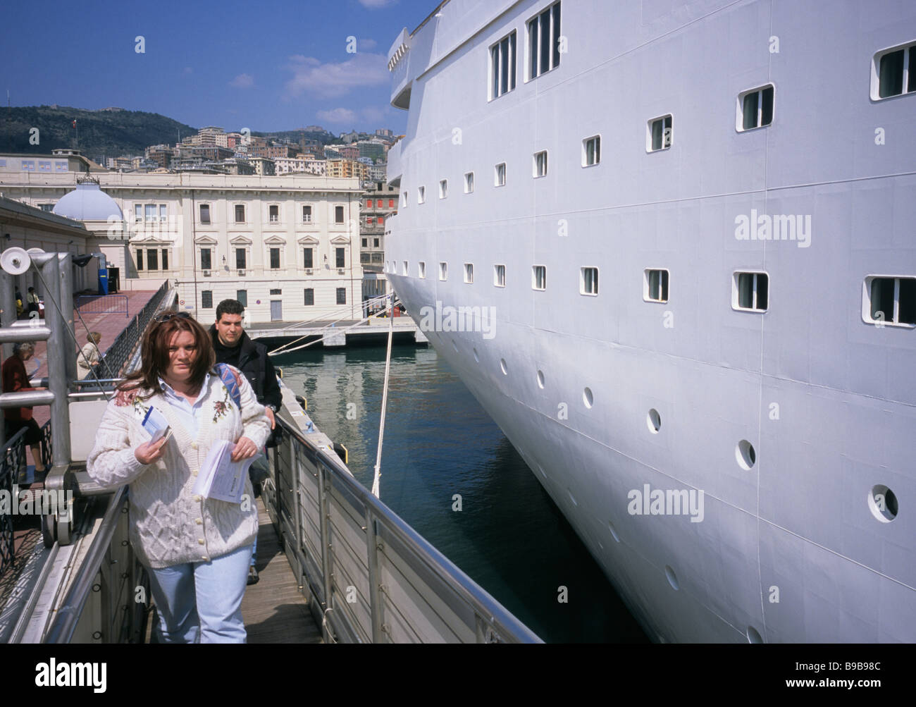 people hand holding tickets embarking on board a cruise ship in the ...