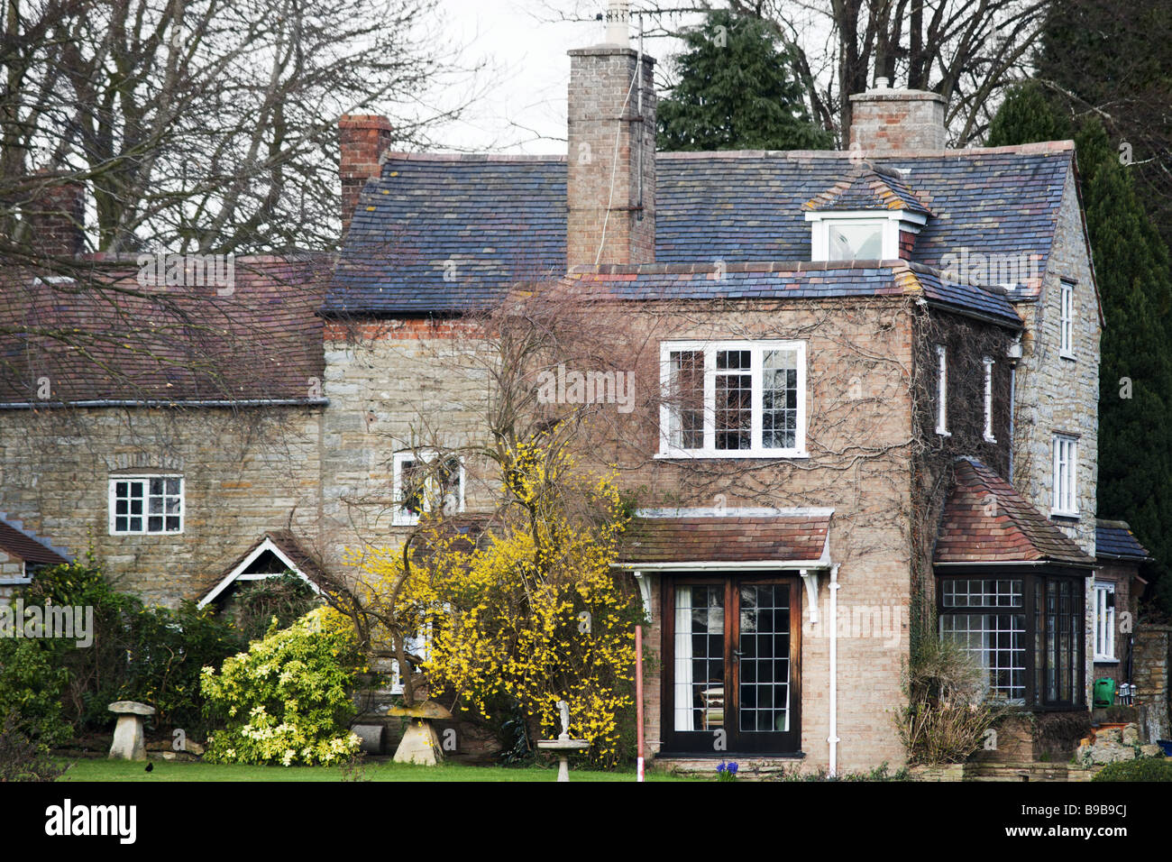 a brick built house in countryside Stock Photo - Alamy