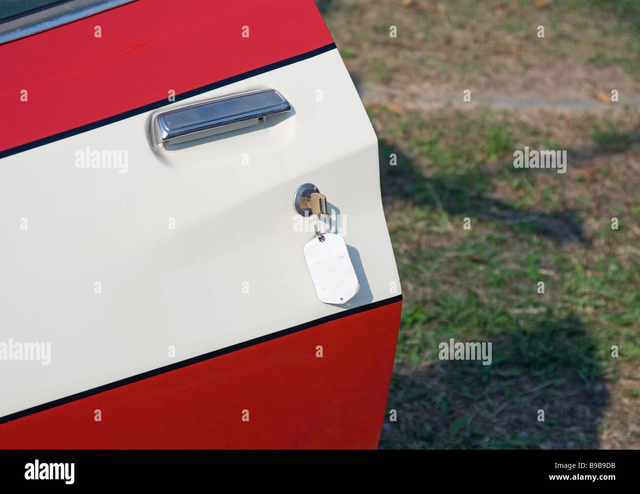 Car door handle with key in lock Stock Photo - Alamy