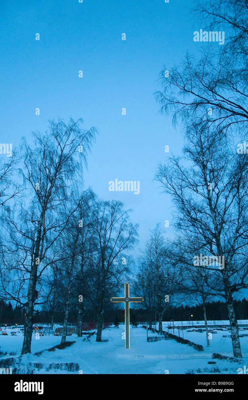 Illuminated cross in churchyard Stock Photo - Alamy