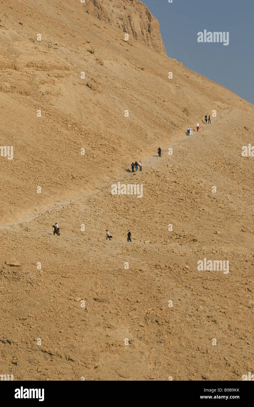 Hikers climbing Masada ancient fortress on the eastern edge of the ...