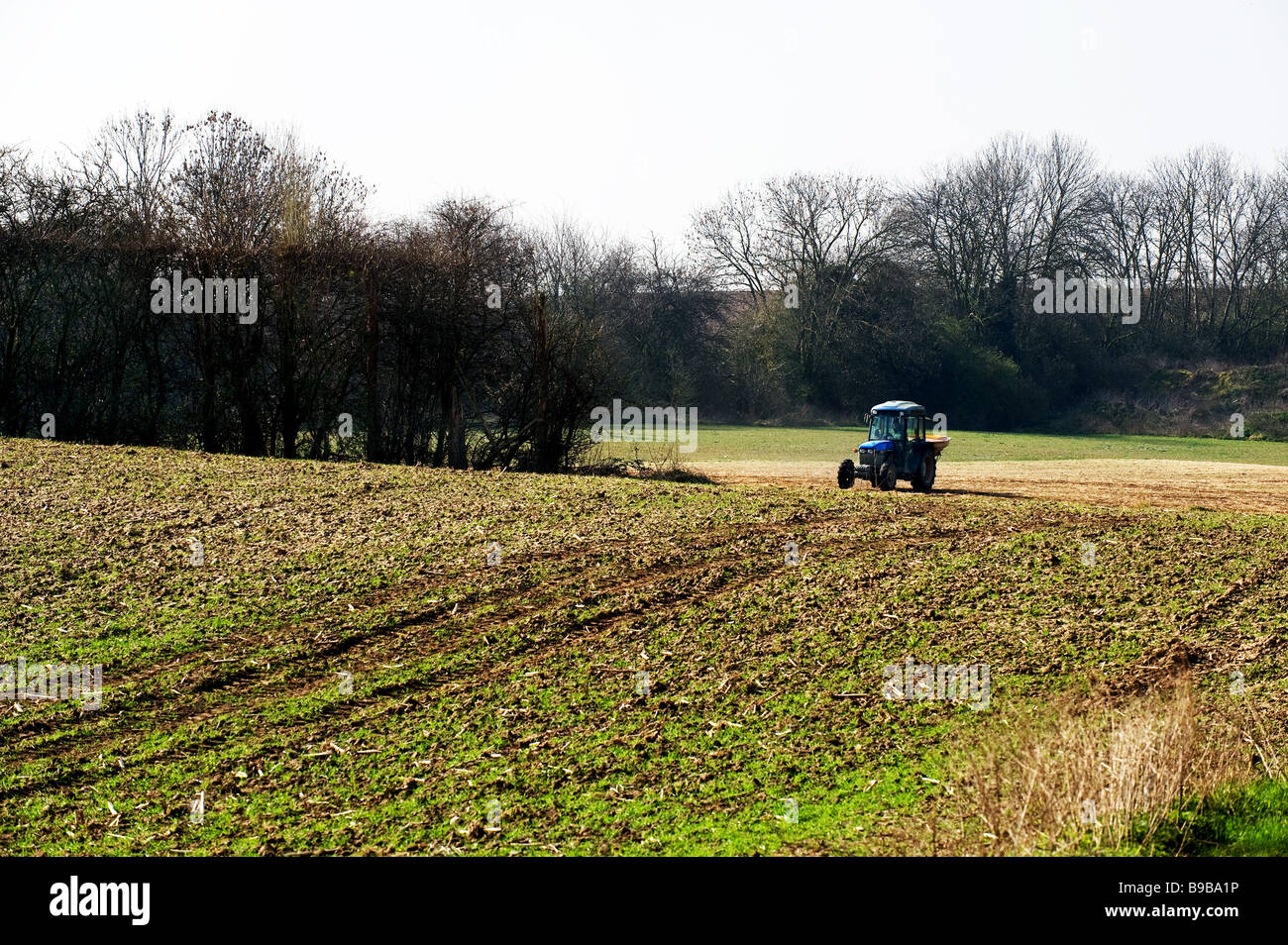 A tractor working on a farm in Kent Stock Photo - Alamy