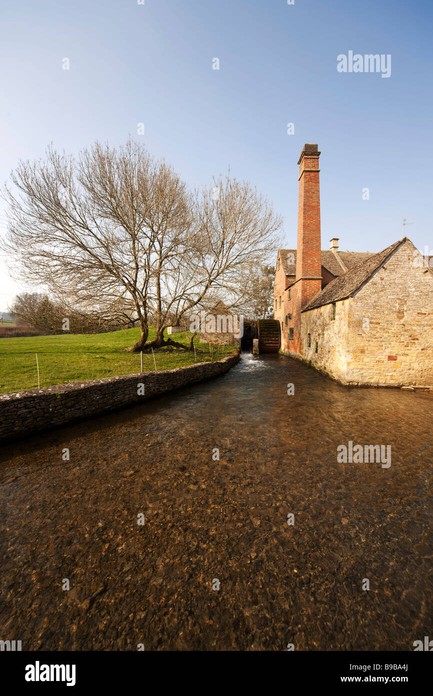 A view of lower slaughter village with the river eye and a mill wheel ...