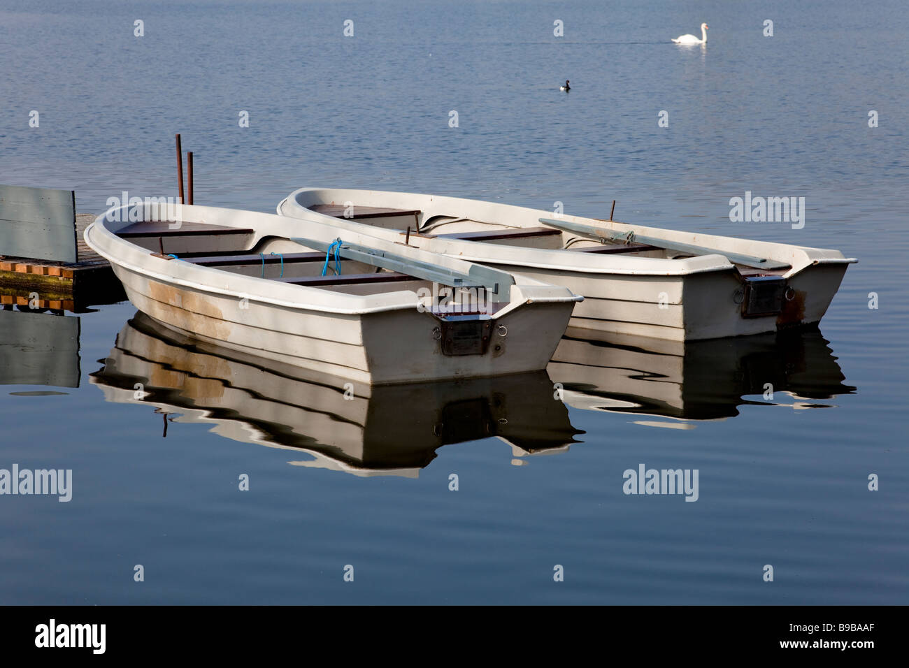 Two rowing boats tied up Stock Photo - Alamy