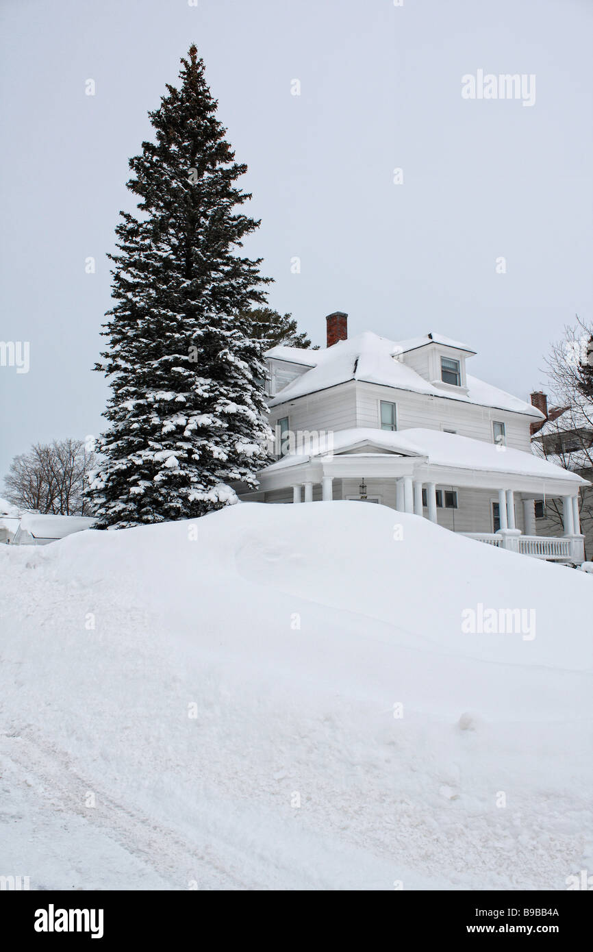 Winter Upper Peninsula Michigan in USA US a small town under snow snowy ...