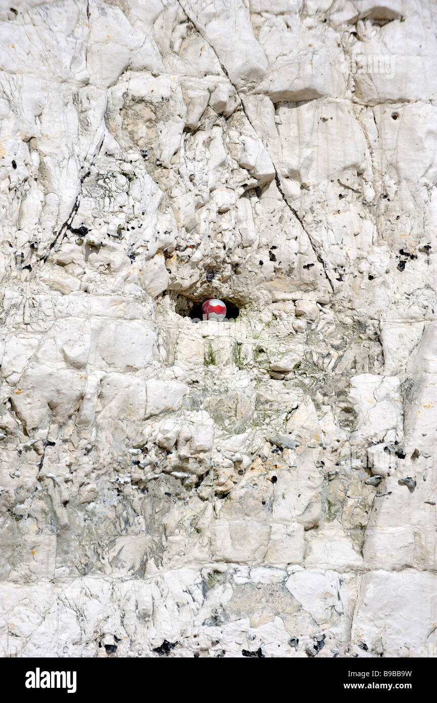 A football stuck in a hole high up a rock face on the undercliff path ...