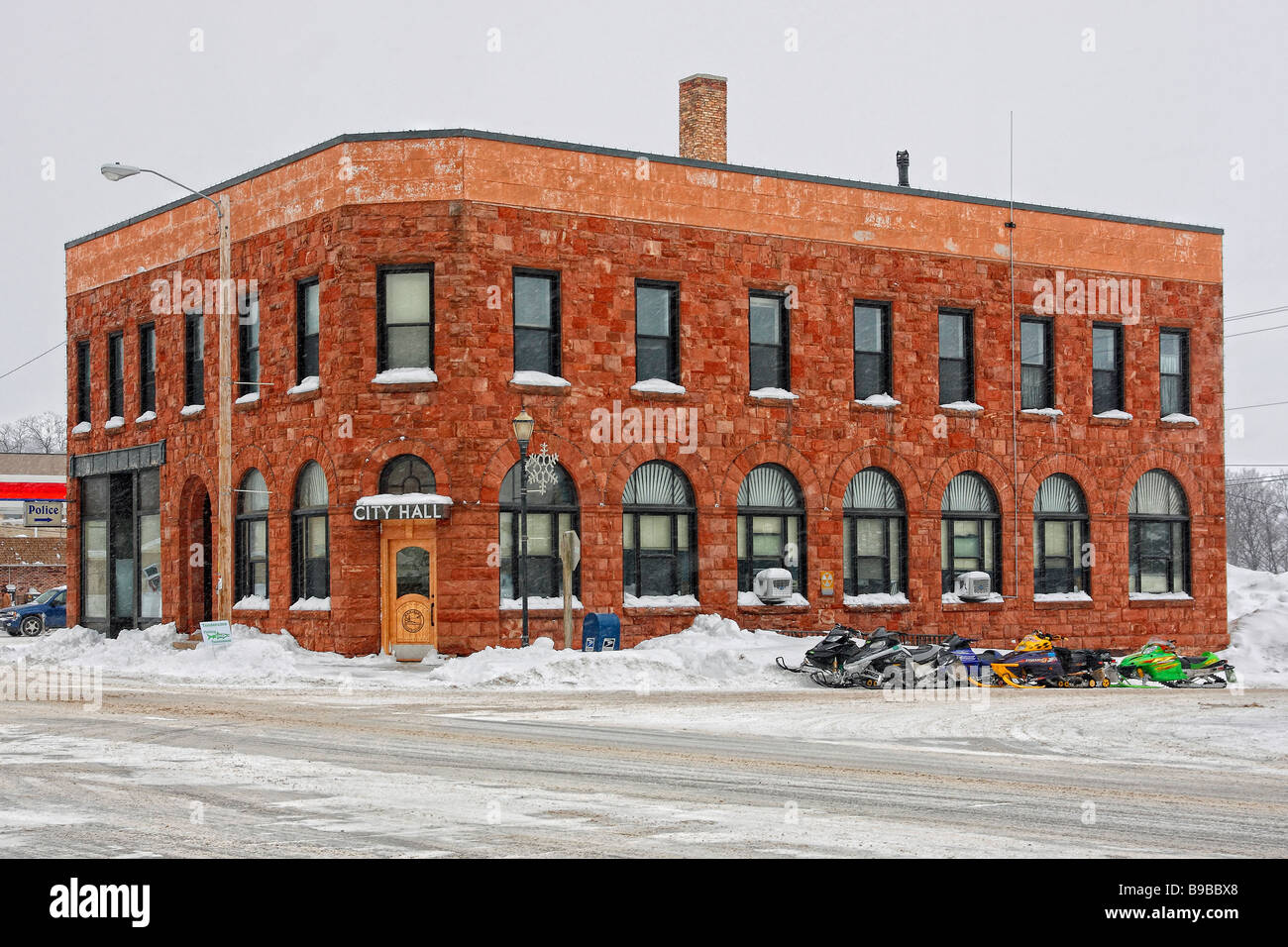 City Hall building in Munising Michigan in winter snow house USA ...