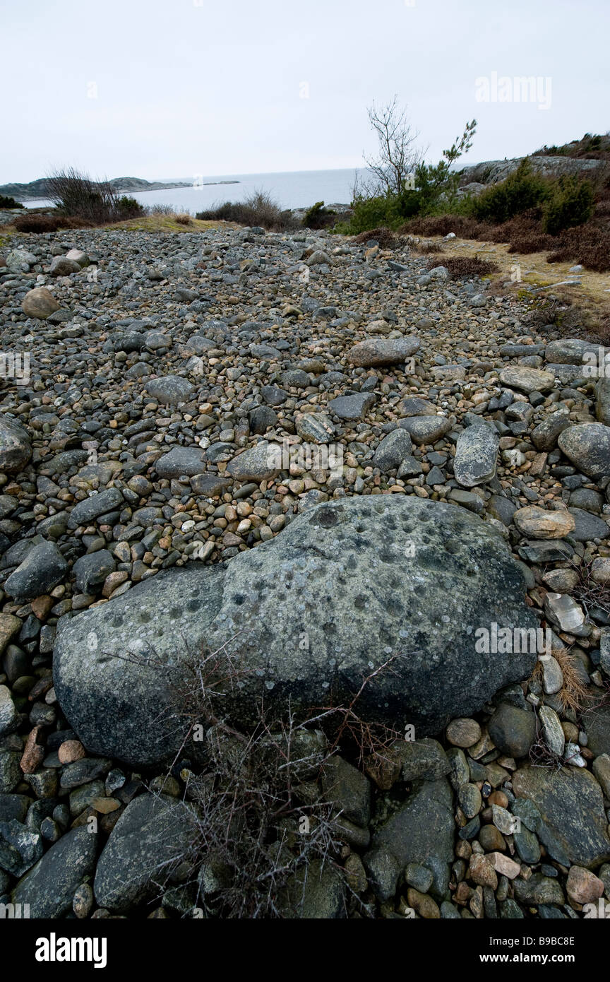 Place of sacrifice, stone with offering holes from the stone age ...