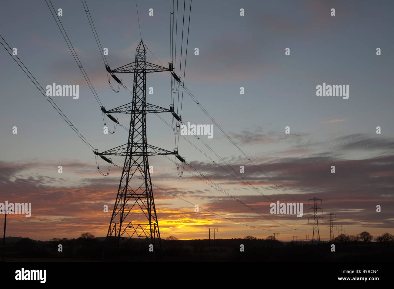 metal pylon carrying electricity supply power lines Stock Photo - Alamy