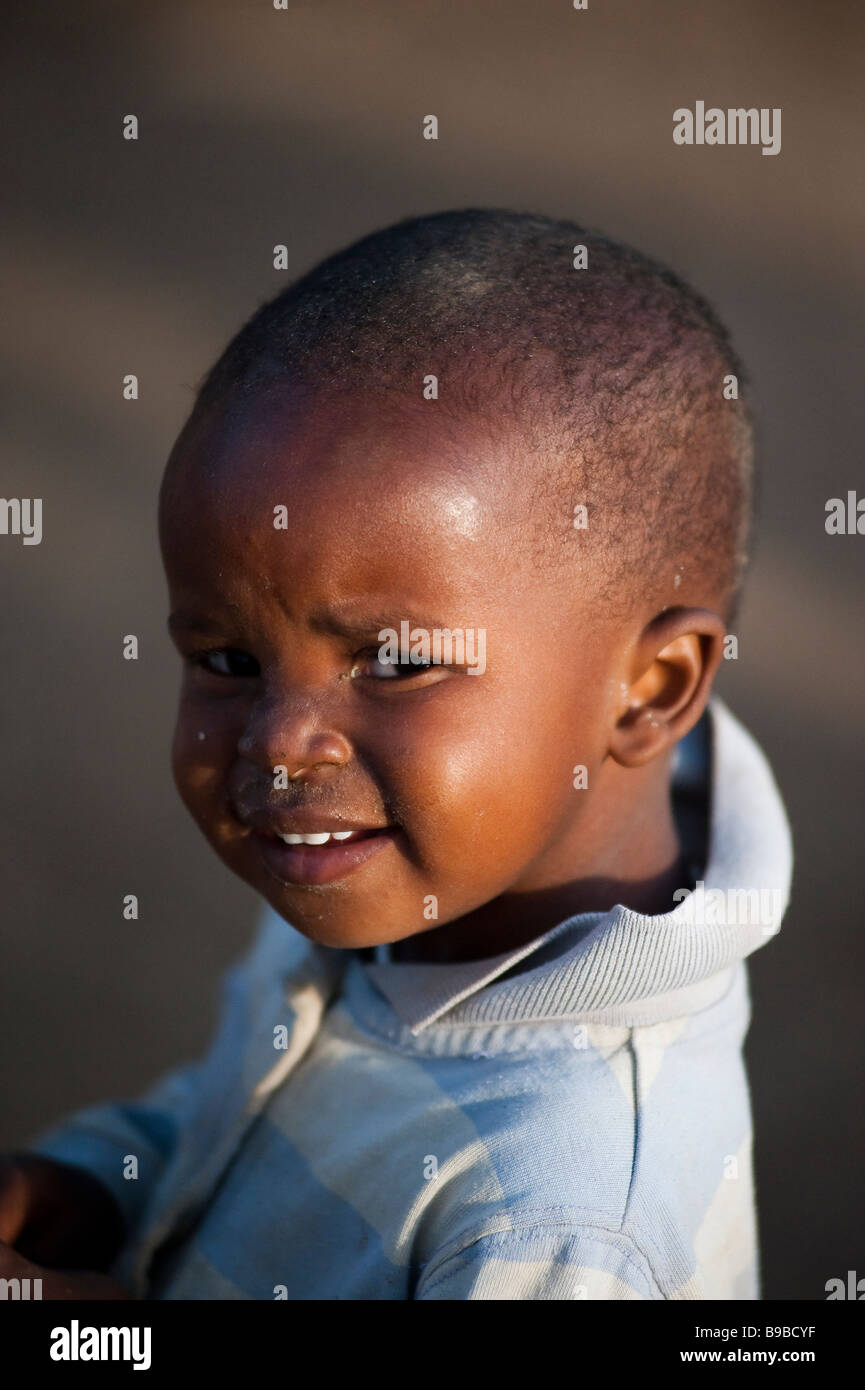 African child squinting at the sun Stock Photo - Alamy