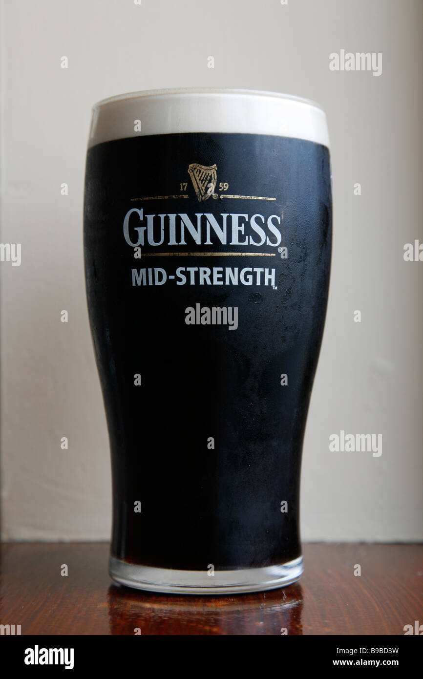 On a pint of guinness hi-res stock photography and images - Alamy