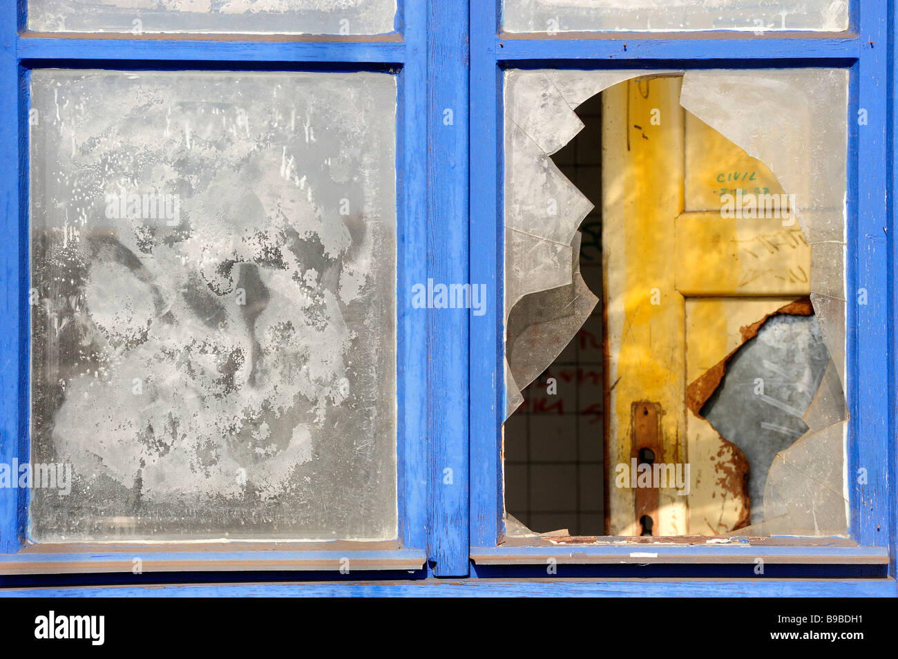 Broken glass window Stock Photo - Alamy
