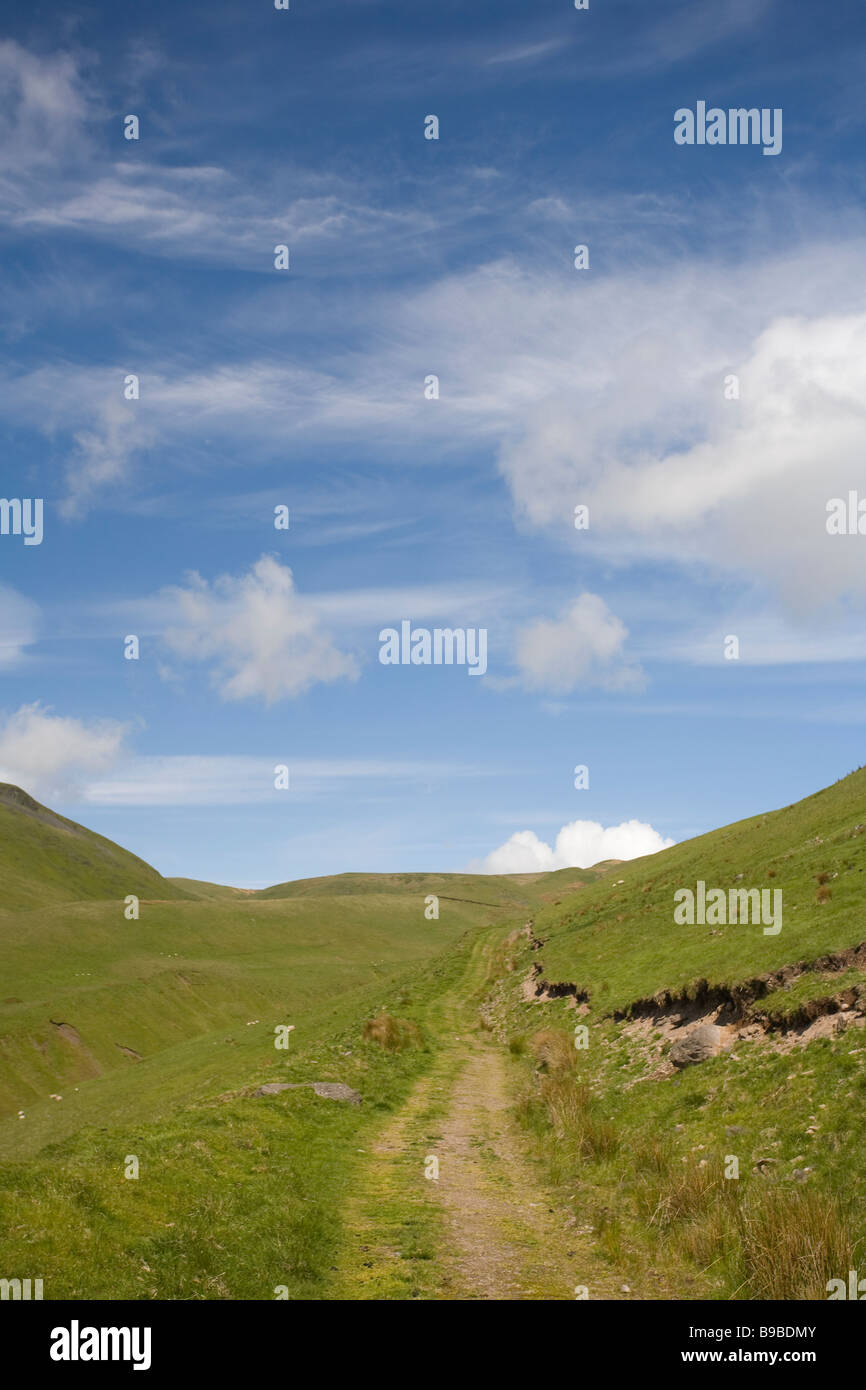 Winding path through rolling green hills Stock Photo - Alamy