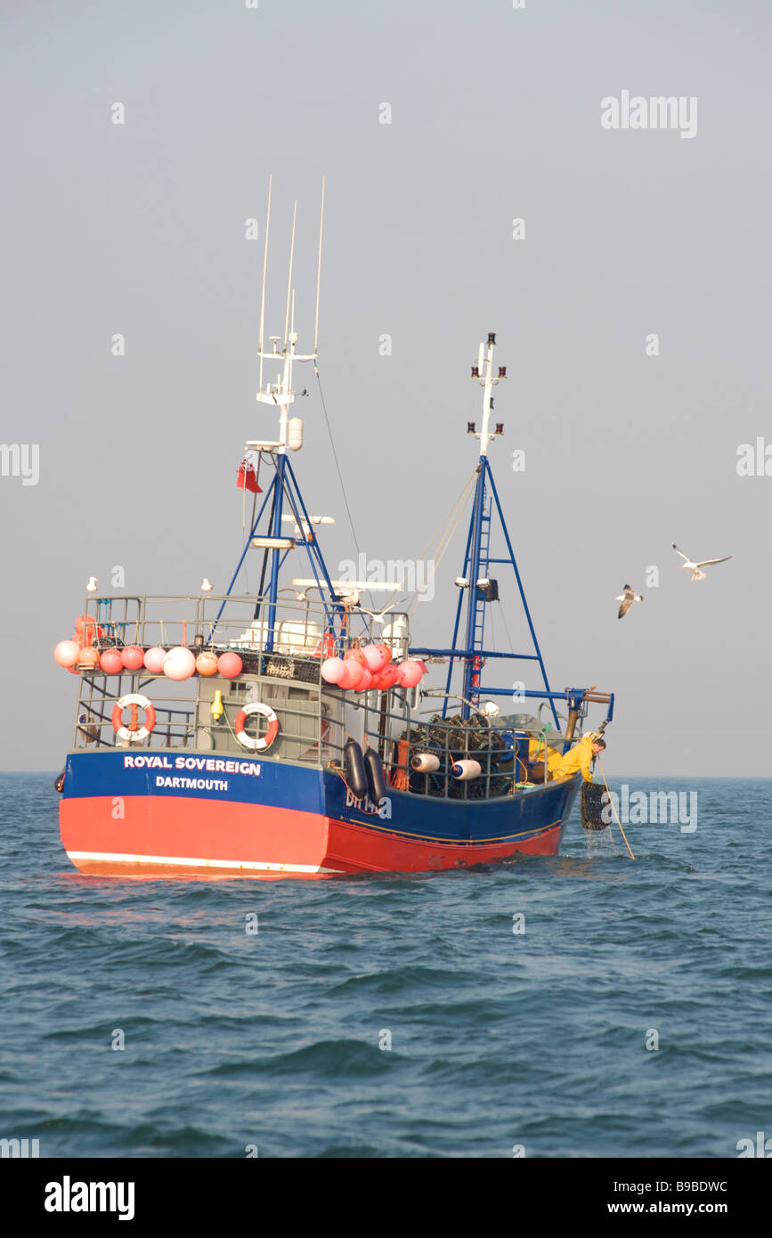 Fishing vessel Royal Sovereign lifting lobster pots at sea in the ...