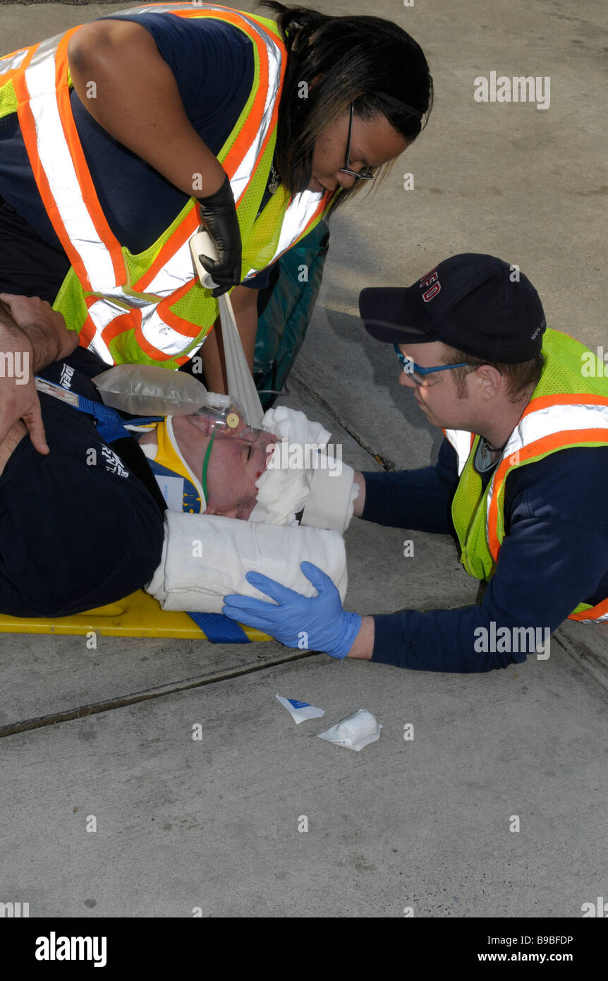 A medic bandages an injured person in Bladensburg, Maryland Stock Photo ...