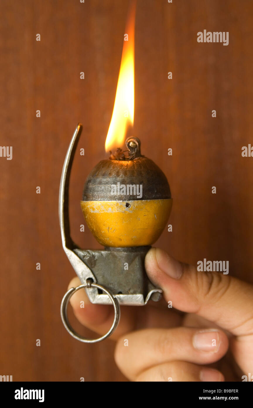 The lighter bomb is constructed from parts of a US M26 hand grenade and ...