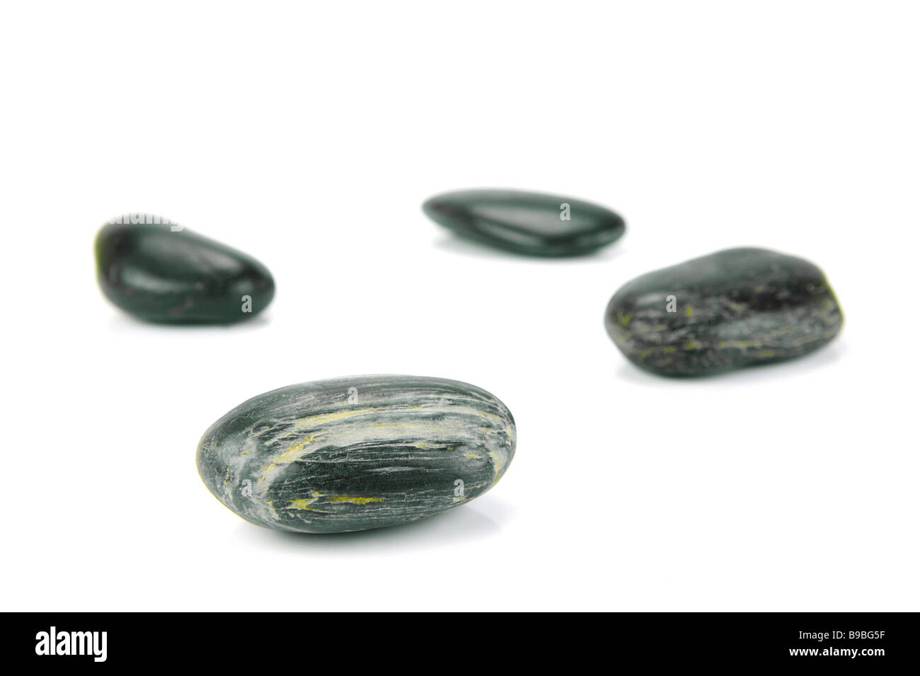 Black river rocks isolated against a white background Stock Photo - Alamy