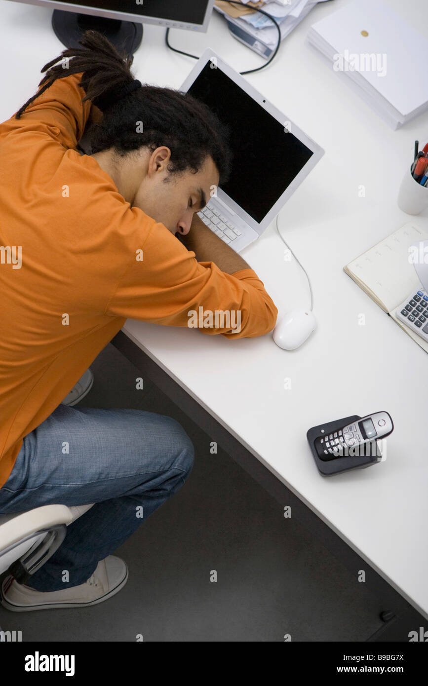 Man napping at desk, overhead view Stock Photo - Alamy