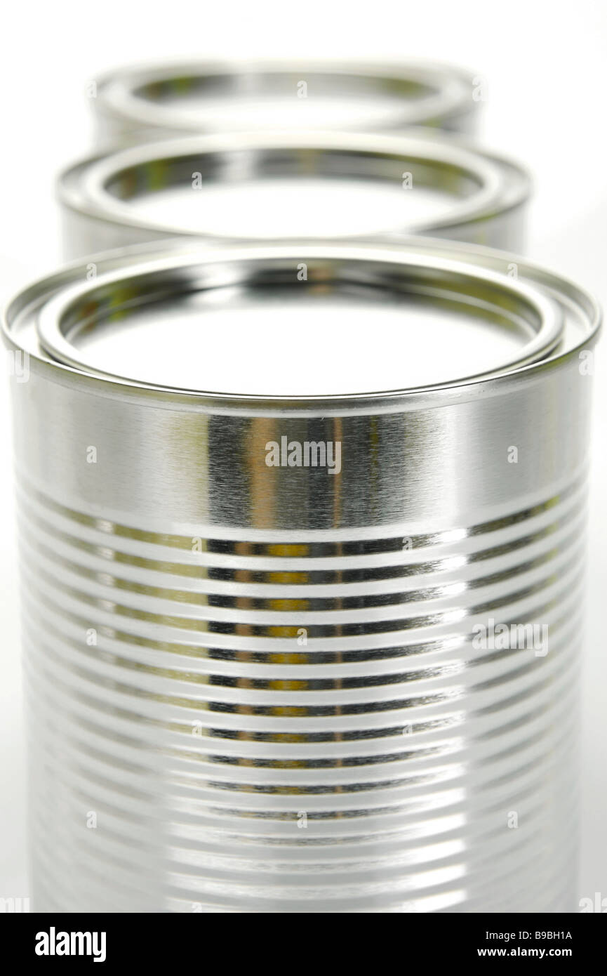 Tin cannisters isolated against a white background Stock Photo - Alamy