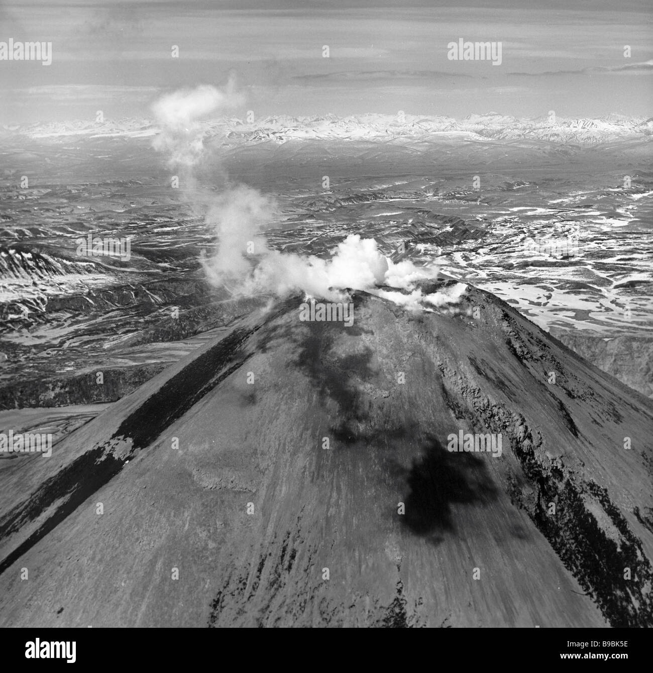 The Karymsky Volcano getting active and smoking Stock Photo - Alamy