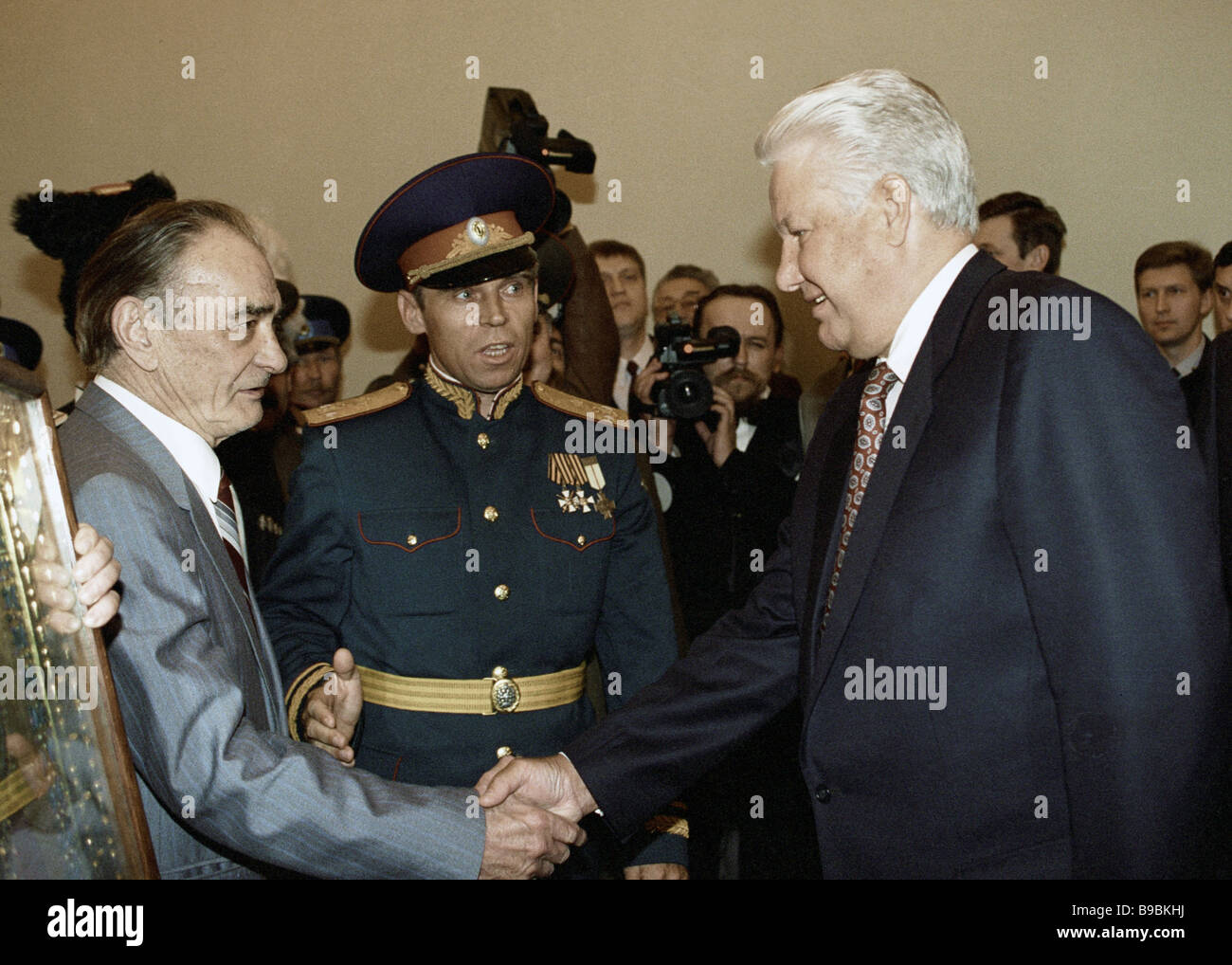 Russian President Boris Yeltsin right greeting the actor Pyotr Glebov left who played the role ...