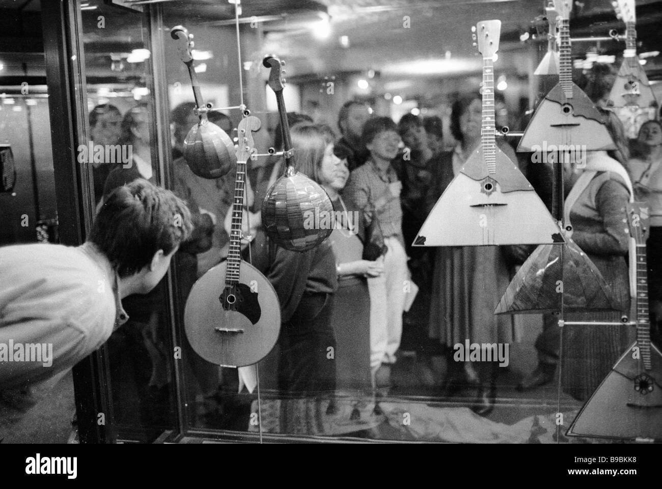 Visitors examine showcases at the Glinka Musical Culture Museum Stock ...
