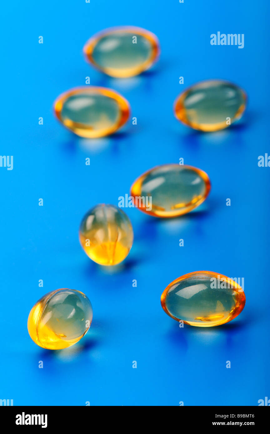 Capsules with natural oils for medical or cosmetic use. Close-up Stock ...