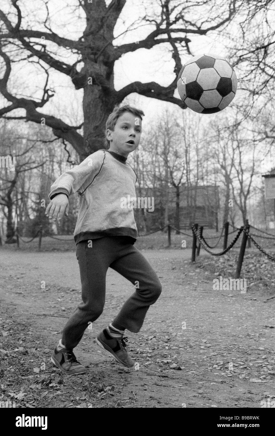 Boy playing ball Stock Photo - Alamy