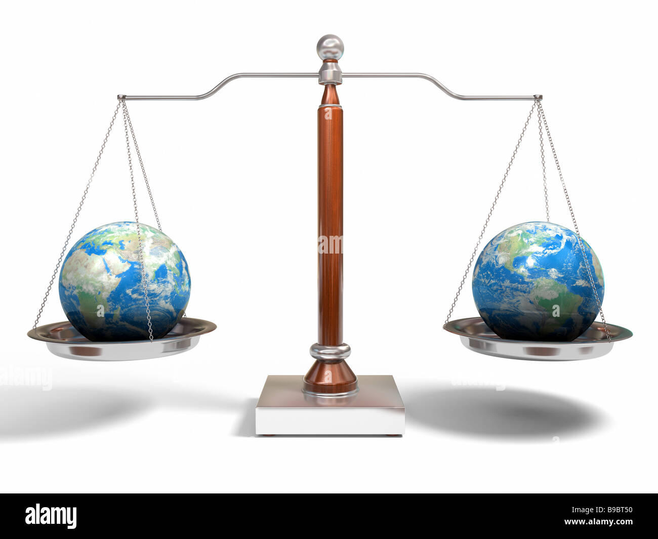 Globes on balance scale Stock Photo - Alamy