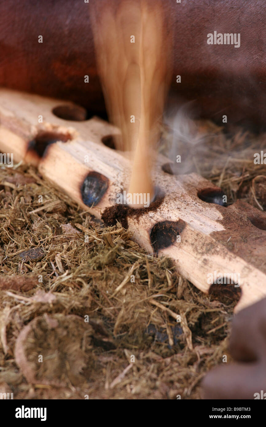 Lighting the fire in a tribe masai Stock Photo - Alamy